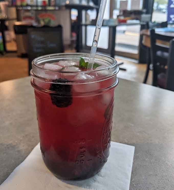Berry-infused refreshment in a mason jar tastes like summer decided to stick around for another season.