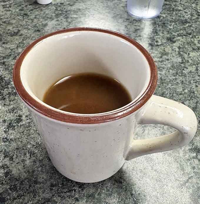 Coffee served in a proper mug because some traditions are worth keeping, especially when you need that morning caffeine.