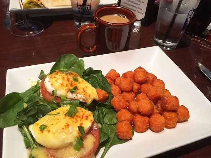 Eggs Florentine sitting pretty on a bed of spinach, because mornings can be fancy and delicious.