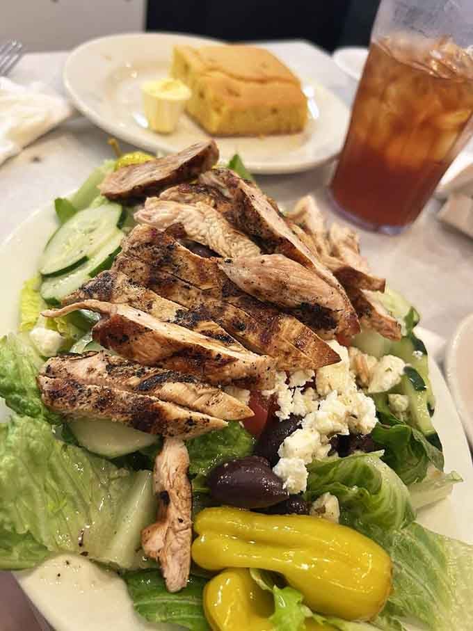 Grilled chicken atop fresh greens with feta and pepperoncini proves that even salads get the royal treatment at Elmo's.