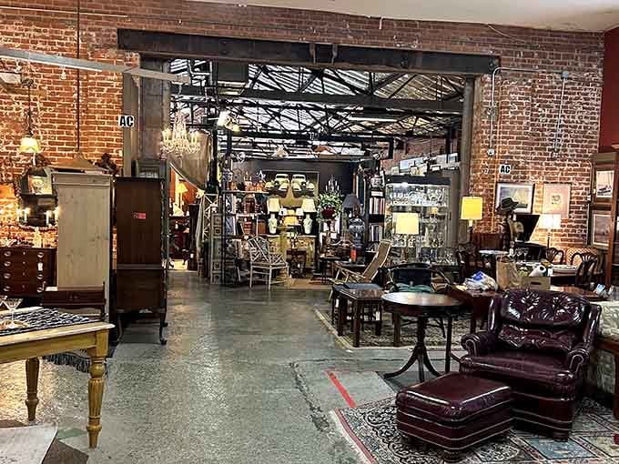 Exposed brick and industrial ceilings frame vintage finds in a setting that feels authentically timeless throughout.