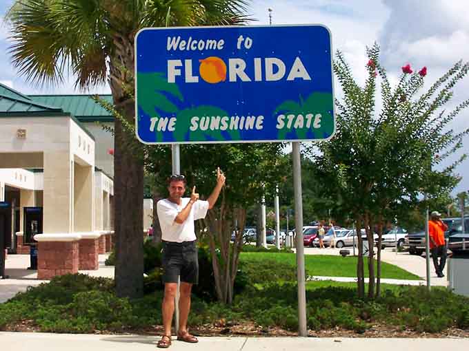 This guy's got the right idea, celebrating his Florida arrival like he just won the lottery.