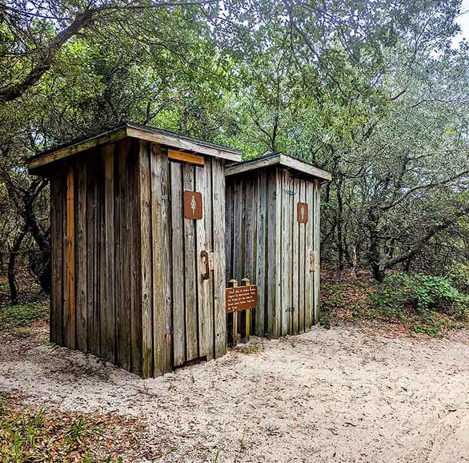 These weathered restrooms represent civilization's last stand before you venture into true wilderness, so use them wisely and gratefully.