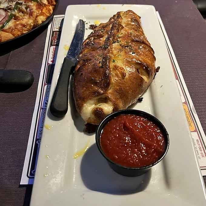 This golden-brown beauty looks like it escaped from a pizzeria in Transylvania, and we're not complaining one bit.