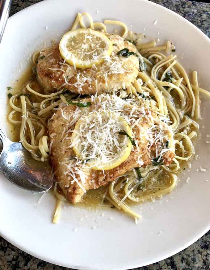 Chicken piccata over pasta with lemon and capers, bringing Italian sunshine to the Massachusetts coastline with style and substance.