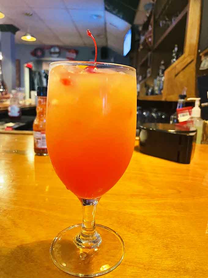 That sunset-colored cocktail with its cheerful cherry on top is practically begging to be your new best friend.