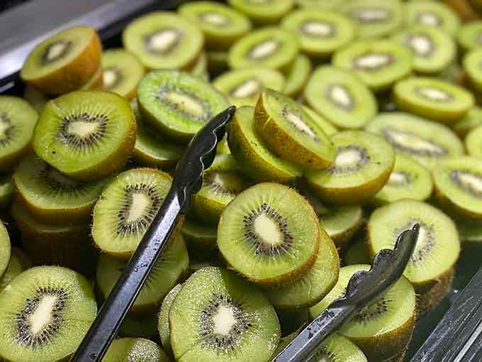 Perfectly sliced kiwi proves that even fruit gets the VIP treatment at a serious buffet operation.