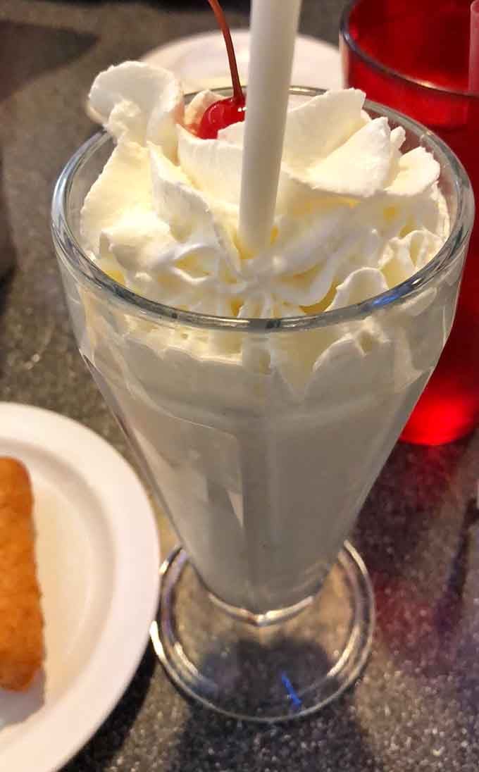 Topped with whipped cream and a cherry, this vanilla shake is pure nostalgia in a glass.