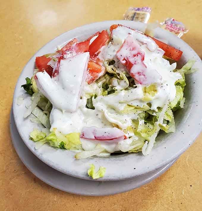 Even the salad gets the royal treatment here, dressed up and ready to surprise vegetable skeptics.