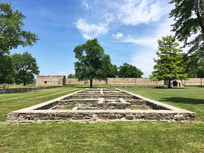 Stone foundations mark where buildings once stood, like a connect-the-dots puzzle from the 18th century waiting to be solved.