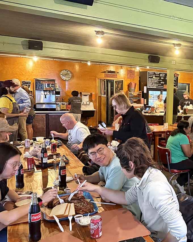 Communal tables mean you'll make friends fast, bonded by smoke rings and the universal language of exceptional barbecue.