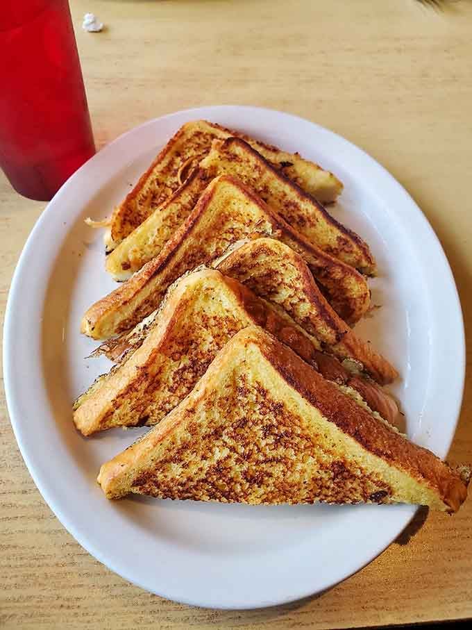 French toast with that perfect golden-brown griddle kiss, simple perfection that doesn't need fancy toppings to shine bright.