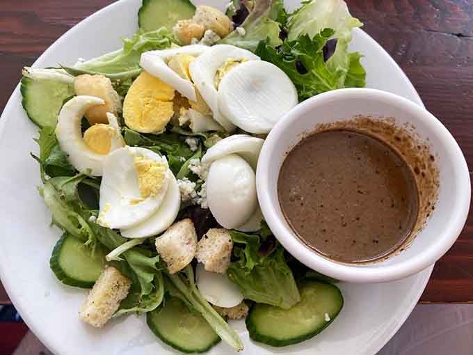 A fresh salad with hard-boiled eggs and balsamic dressing offers a lighter counterpoint to all that glorious bread.