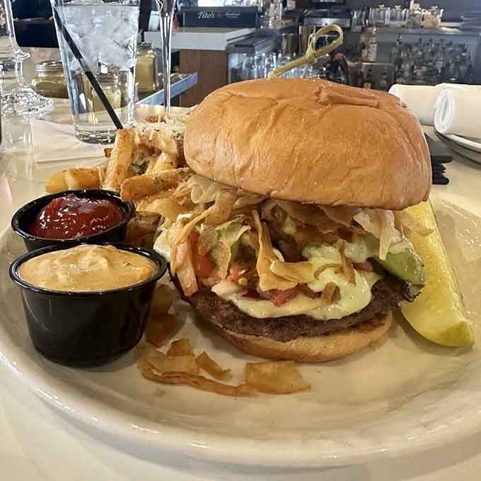 The taco burger stacks high with all the fixings, proving fusion cuisine doesn't require a culinary degree to work.