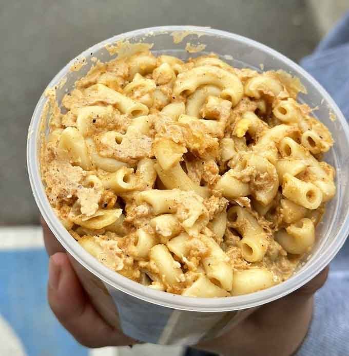 Mac and cheese so creamy and golden, it could make a grown adult weep tears of pure joy.