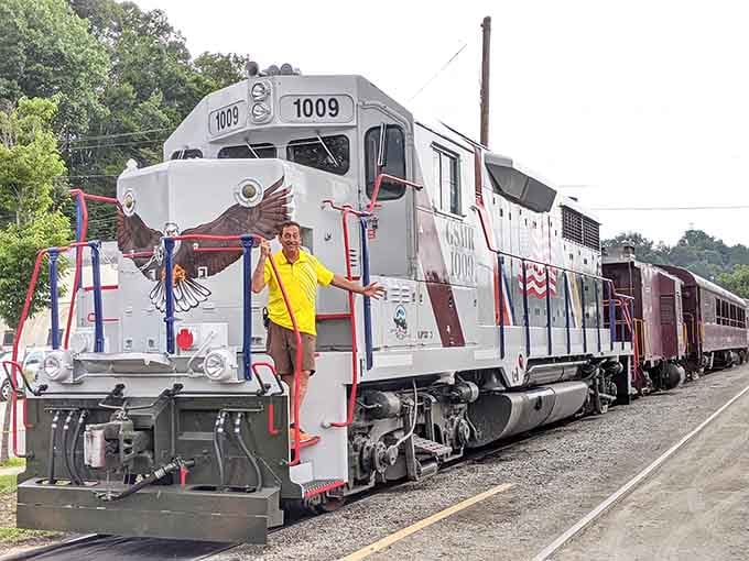 The patriotic locomotive stands ready for duty, flags flying, looking sharp enough to make any train enthusiast weep with joy.