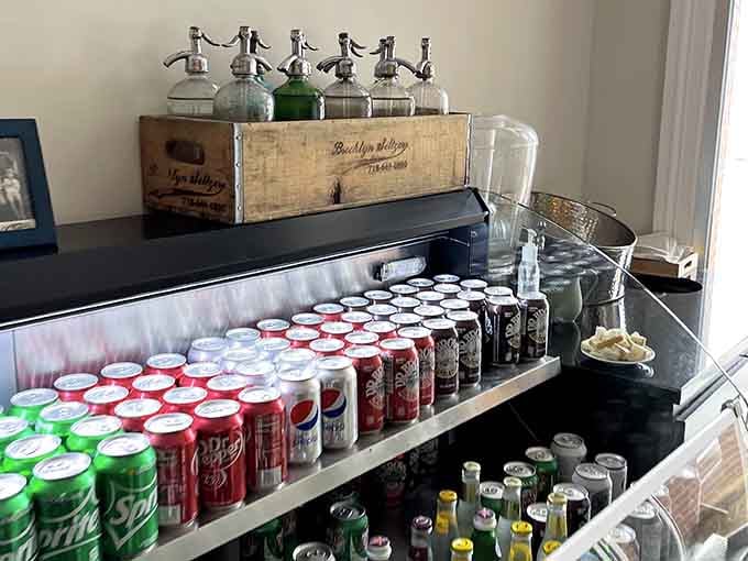 Vintage seltzer bottles and organized chaos behind the counter signal serious deli credentials and delicious things ahead.