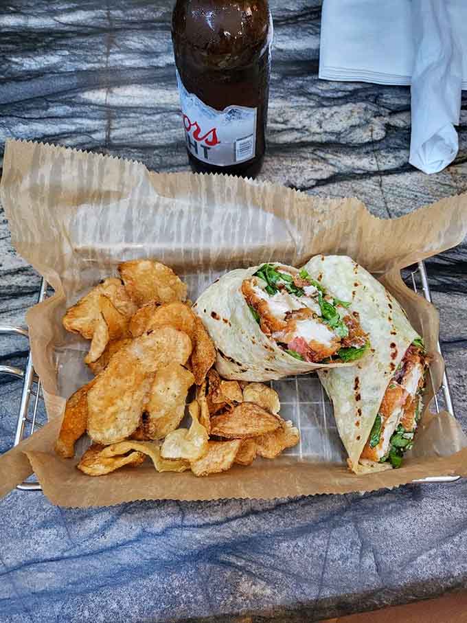 A chicken wrap paired with house-made chips, because sometimes simple done right beats complicated done wrong.
