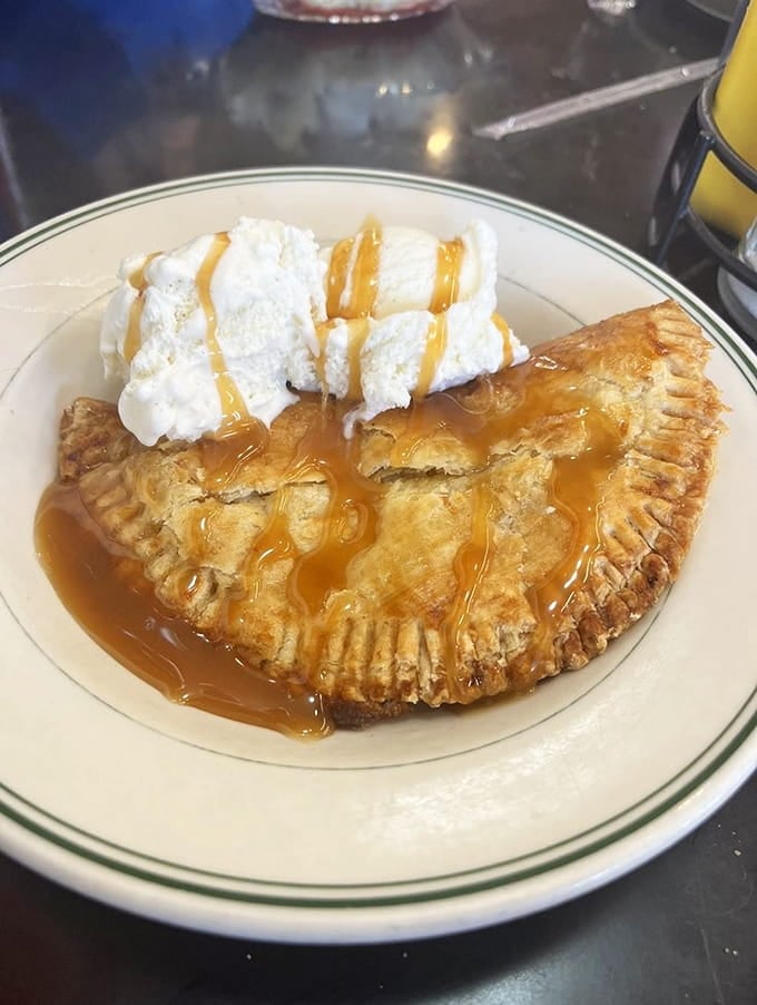 Apple crisp topped with ice cream and caramel proves that some desserts are worth loosening your belt for immediately.