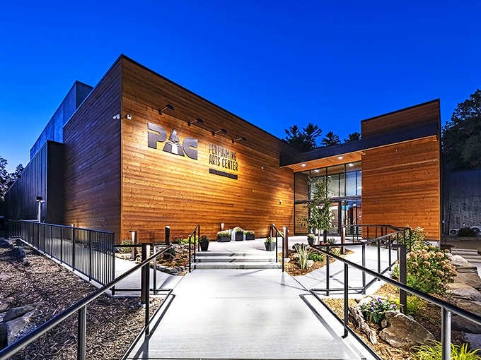 Modern mountain architecture meets cultural sophistication in a building that respects its natural surroundings beautifully.