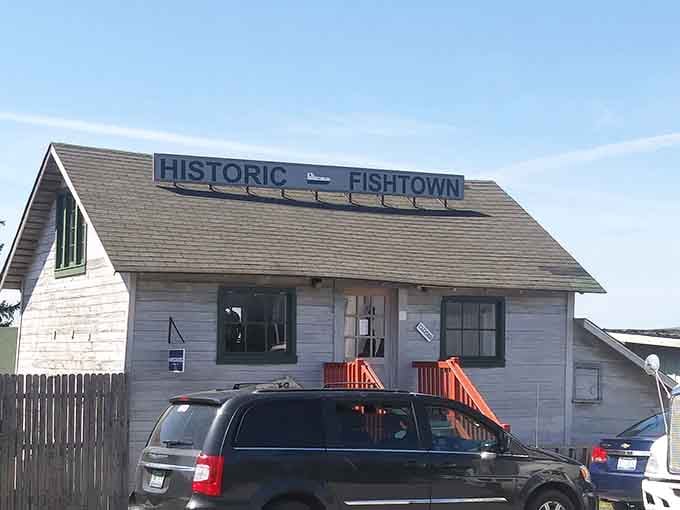 Even the parking area can't hide what awaits beyond: a perfectly preserved slice of Michigan fishing heritage.