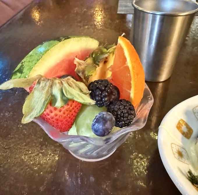Fresh fruit bowl so colorful it looks like a rainbow decided to become healthy and delicious simultaneously.