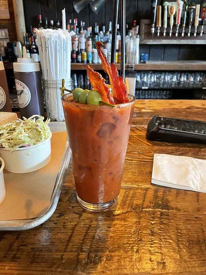 That Bloody Mary comes loaded with bacon like a brunch cocktail decided to crash the barbecue party.