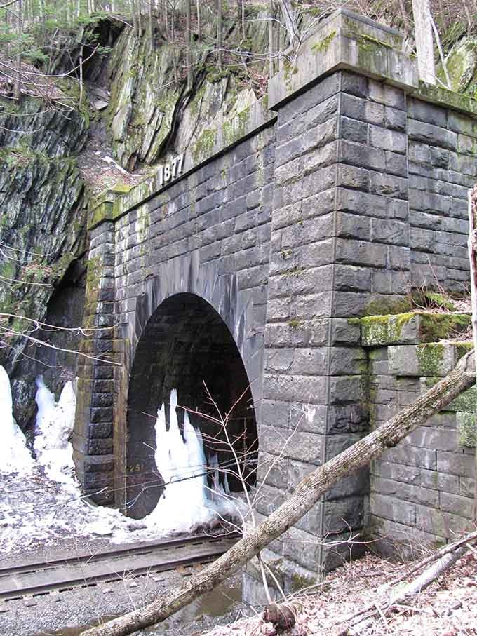 Moss-covered stonework tells you nature's been trying to reclaim this place for over a century without much success.