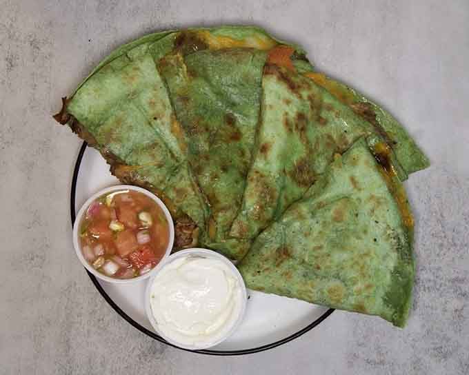 Green quesadillas that prove sometimes the most colorful dishes deliver the most satisfying flavors and crunch.
