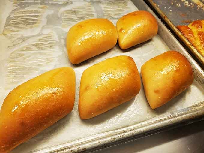 Fresh-baked rolls glistening with butter, ready to soak up gravy or disappear on their own in record time.