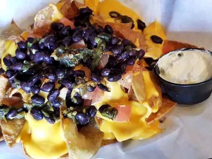 Nachos piled high with black beans and cheese, because sometimes more is definitely more in the best way.