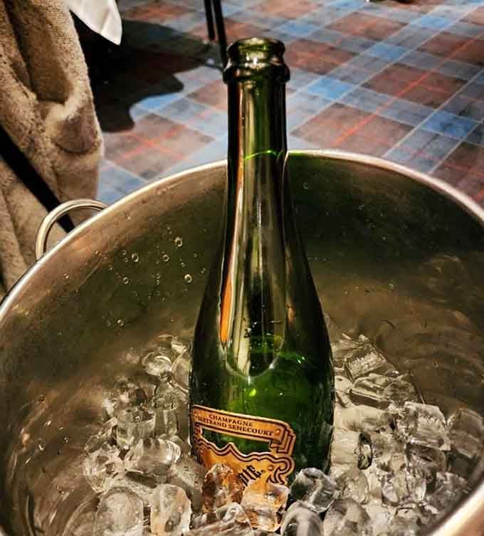 Champagne chilling properly because some restaurants still understand that details matter, even the cold bubbly ones.