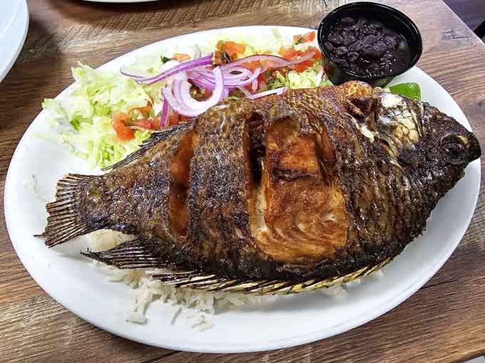 A whole fried fish this perfectly crispy and golden deserves its own standing ovation at the dinner table.