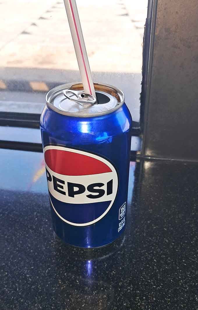 A cold Pepsi with a straw means you're doing lunch right, especially when hot dogs are involved here.