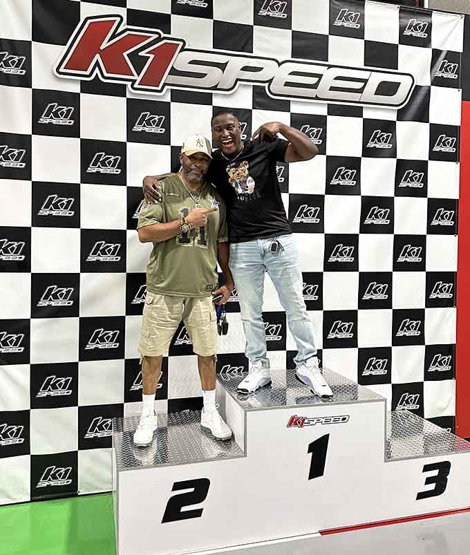 Victory tastes sweeter when you're standing on an actual podium, trophy in hand, grinning like you just won Monaco.