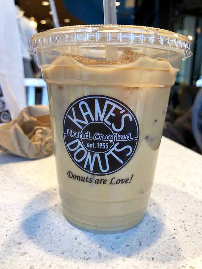 French vanilla iced coffee in a cup that proudly declares "Donuts are Love," which is just stating facts, really.