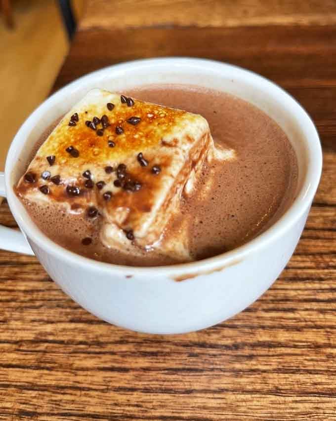 Toasted marshmallow floating in drinking chocolate is the kind of genius move that changes lives, not just afternoons.