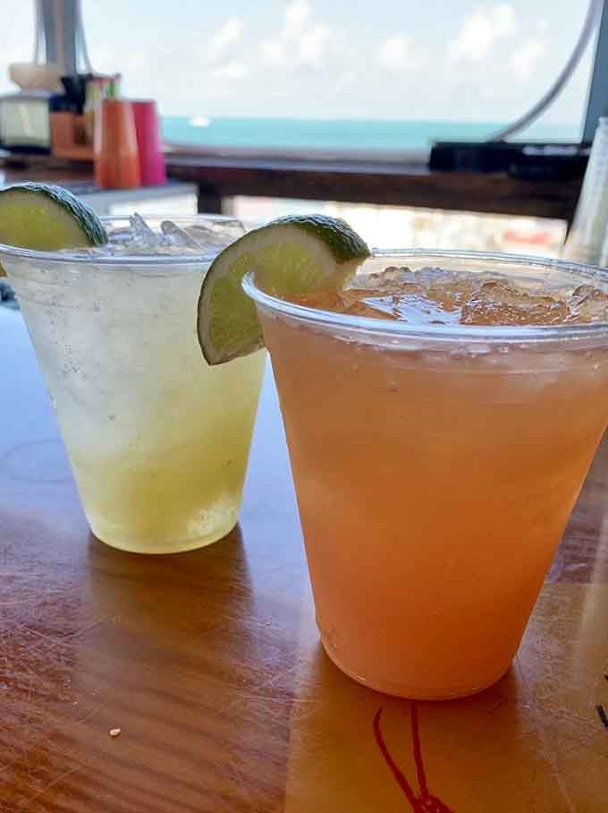 Tropical cocktails with an ocean view, because paradise tastes even better when you're actually sitting in it right now.