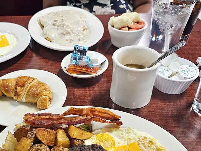 Coffee, croissants, and biscuits with gravy create the kind of breakfast spread that makes hitting snooze seem foolish now.