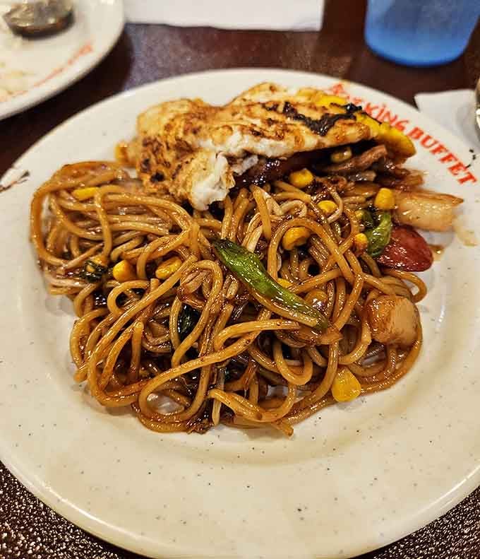 These glistening noodles with grilled chicken prove that buffets can deliver on flavor, not just volume and variety.