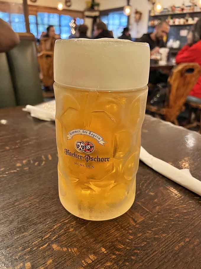 That proper German beer stein filled with golden lager is basically a hug in glassware form, foam cap included.