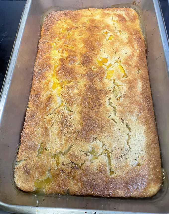 Peach cobbler baked to golden perfection, because every Cajun feast deserves a sweet Southern ending.