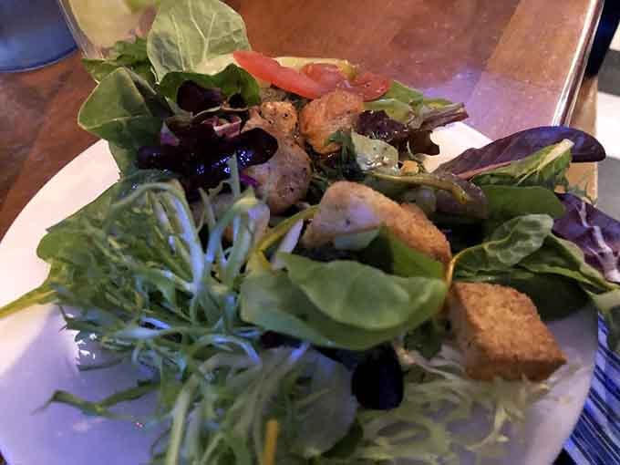 Even the salads get star treatment here, fresh greens with crispy additions that actually make vegetables exciting.