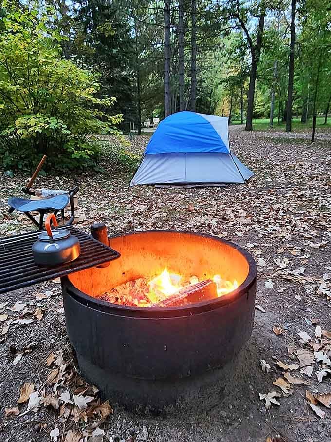 A cozy campsite complete with crackling fire ring, because s'mores don't make themselves, unfortunately.