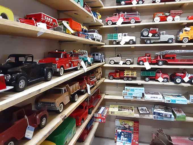Vintage toy trucks lined up like a miniature parking lot from a more innocent, lead-paint-filled era.