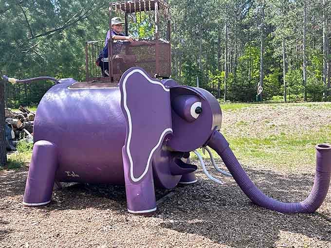 Purple elephants aren't just for cartoons anymore, especially when they're climbable and grinning at delighted visitors all day.