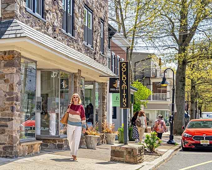 Stone buildings house galleries and shops where actual humans work, not corporate overlords in distant office towers somewhere.
