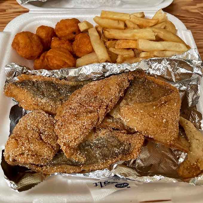 Golden catfish with hush puppies and fries proves this place handles land and sea with equal Southern expertise.