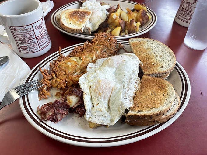 This breakfast platter means business with eggs, hash browns, corned beef hash, and toast for serious appetites.