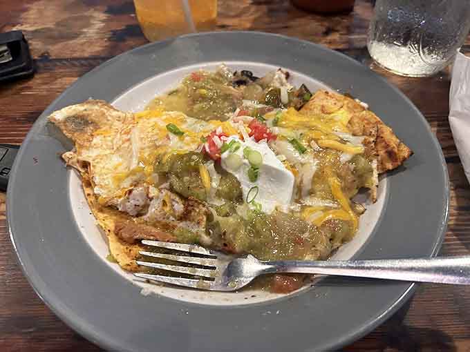 This omelet doesn't mess around with portions, arriving loaded with everything good and topped with salsa verde.